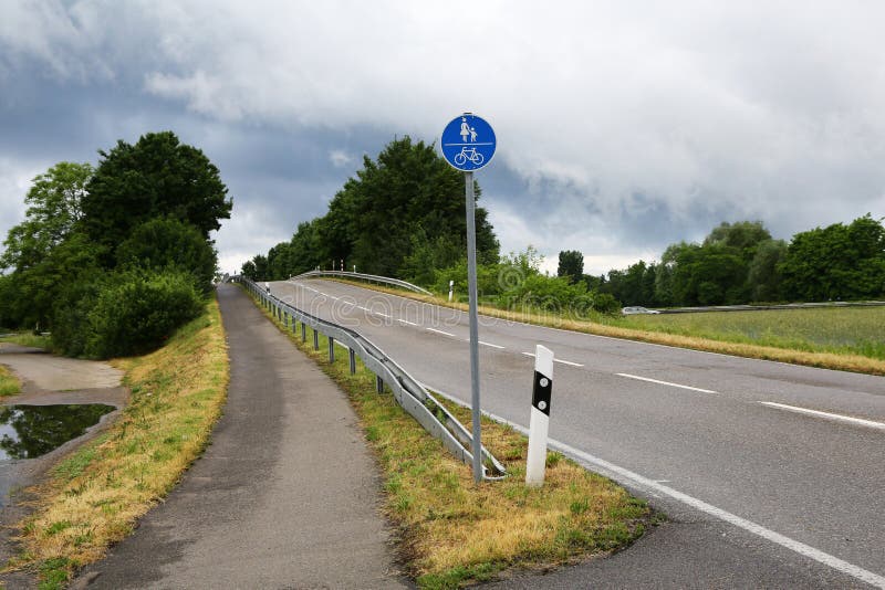 View of a Road and a Footpath with Signage Stock Image - Image of ...