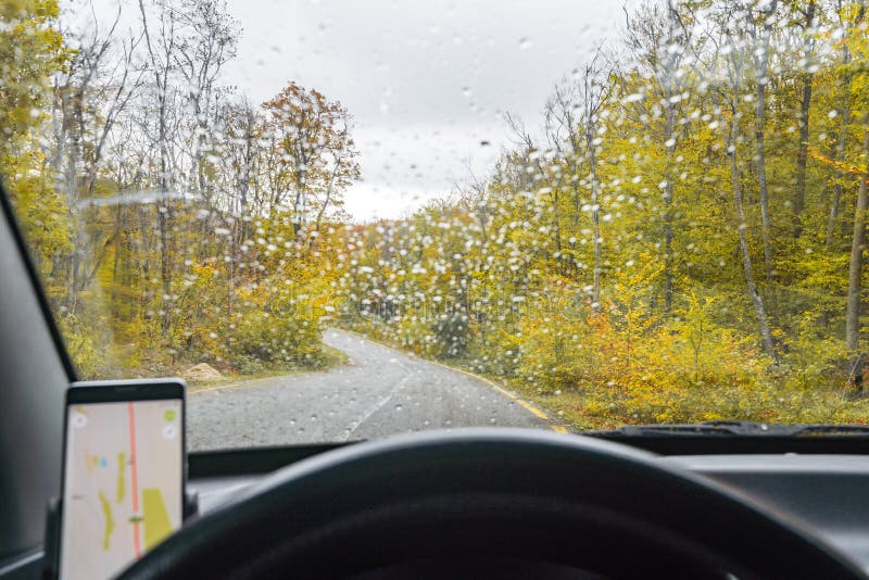 View of the Road through the Windshield in Rainy Autumn Season Stock ...