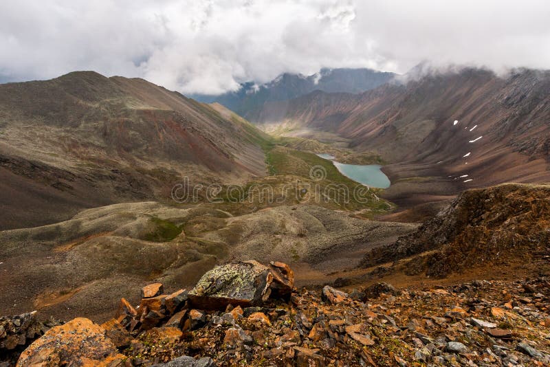 View from a Rocky Mountain Pass into a Valley with a Lake. Stock Image ...
