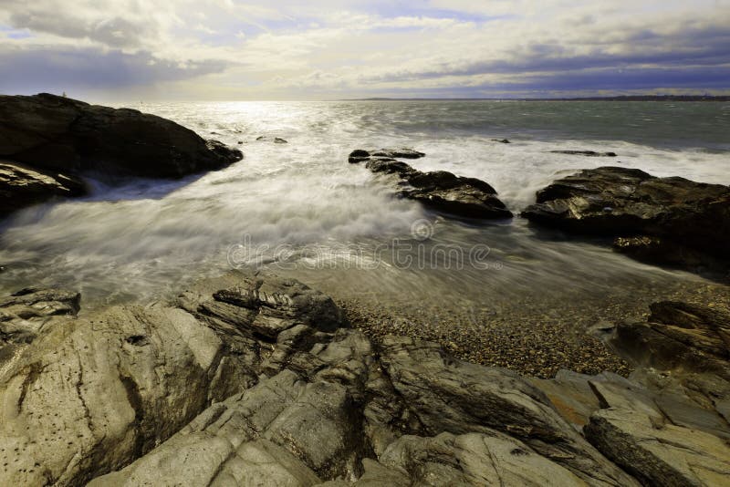 Sunset on a rocky shore stock photo. Image of seas, edge - 173395064