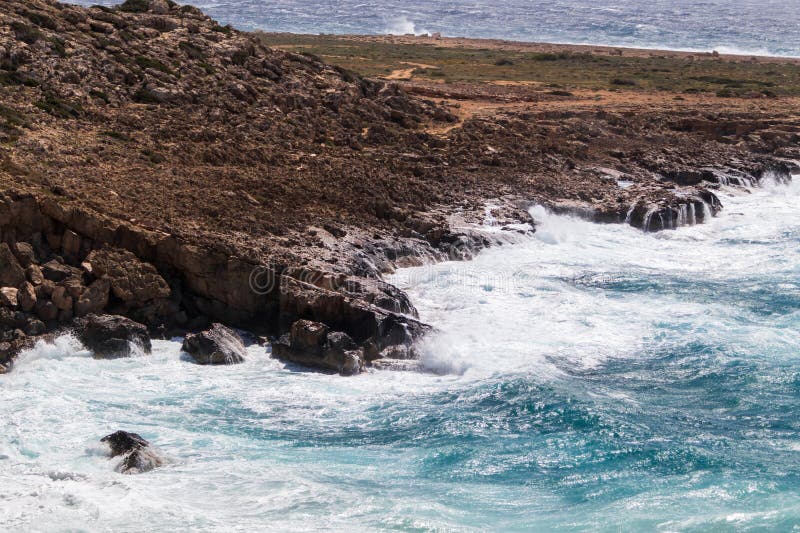 View of a Rocky Ocean Shore with Water Splashing from the Waves Stock ...