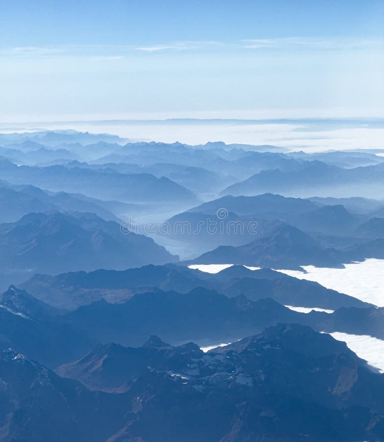 A View of Rolling Mountains from Above the Clouds Stock Photo - Image ...