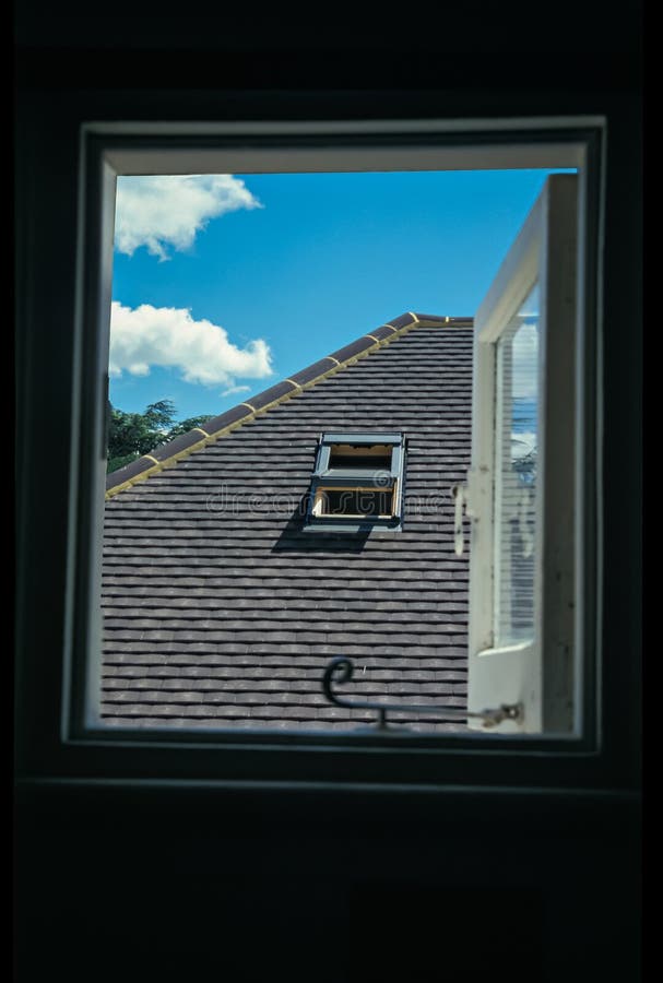 View of Rooftop with Skylight from a Window Frame Stock Image - Image ...