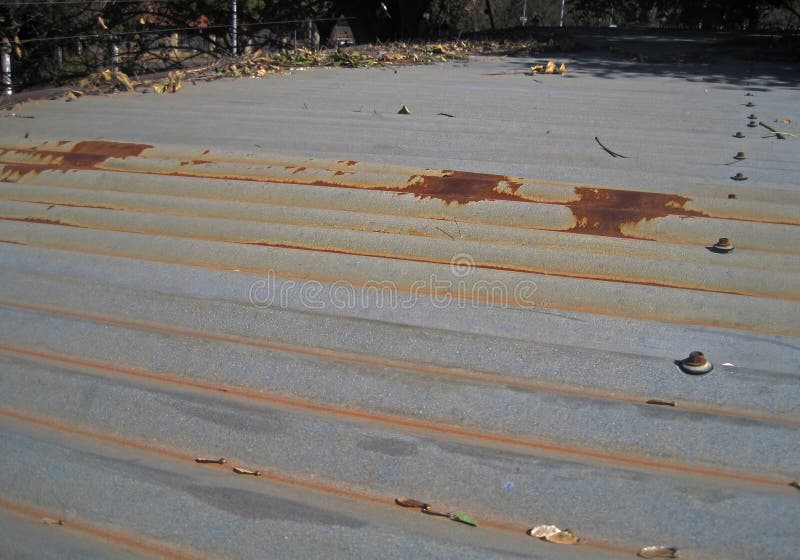 RUST PATCHES on a CORRUGATED IRON ROOF Stock Photo - Image of patches ...