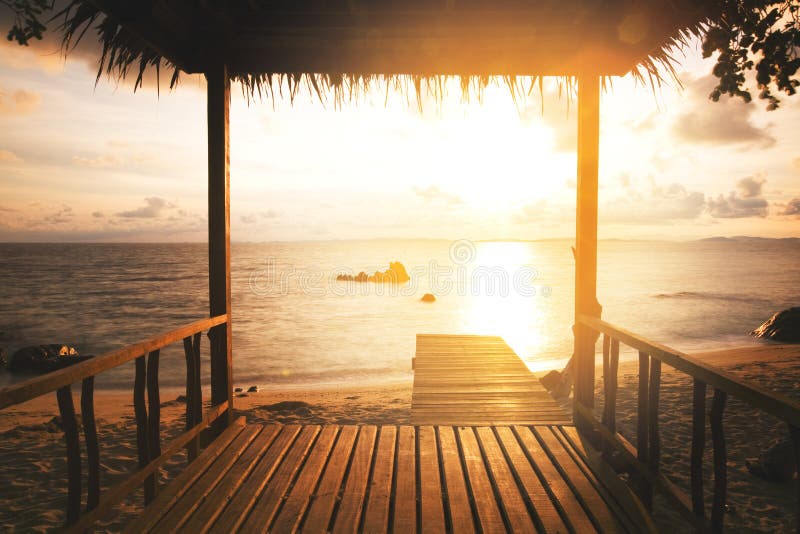 Hut by the sea at sunset stock photo. Image of horizontal - 116530628