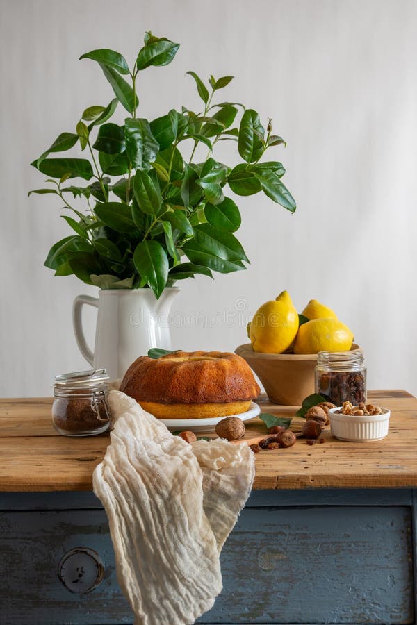View of Rustic Kitchen Table with Bundt of Lemon, Walnuts, Hazelnuts ...