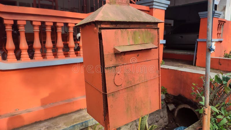 View of an Rustic Orange Mailbox Tied with Wire Stock Photo - Image of ...
