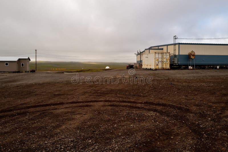 View of a Rusty Container and Quad Bike in a Field Under the Cloudy Sky ...