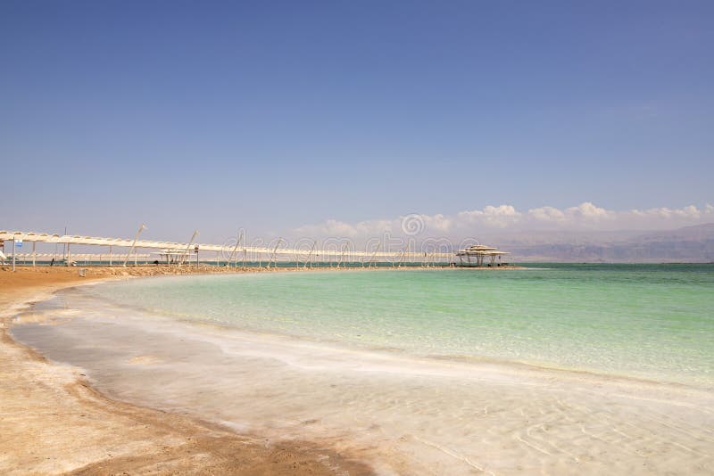 View of the Salt-covered Coastline and Sun Umbrellas on the Dead Sea ...