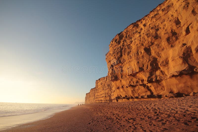 A View of a Sandy Beach with the Tide Retreating and Sandy Cliffs Stock ...