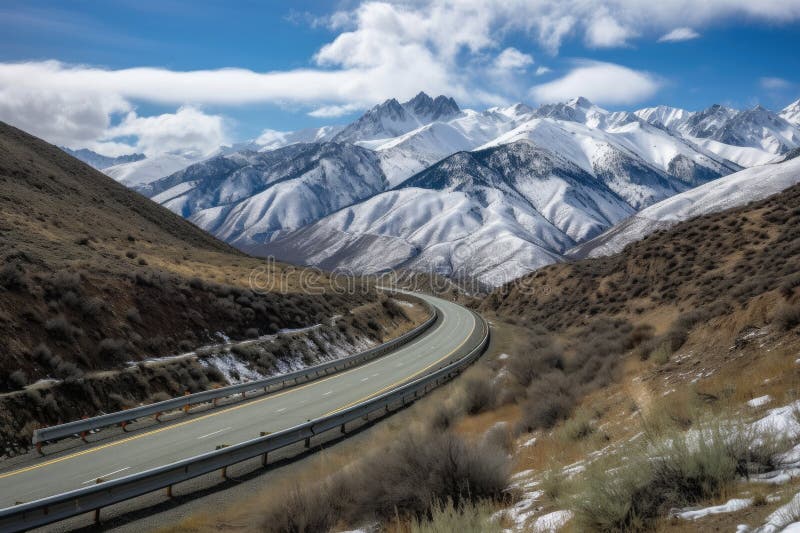 View of Scenic Highway Rolling through the Mountains, with Snow-capped ...