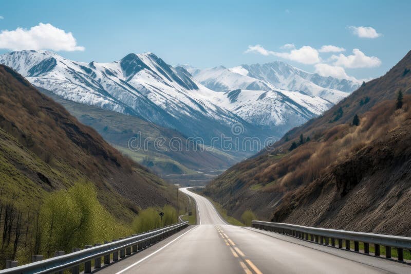 View of Scenic Highway Rolling through the Mountains, with Snow-capped ...