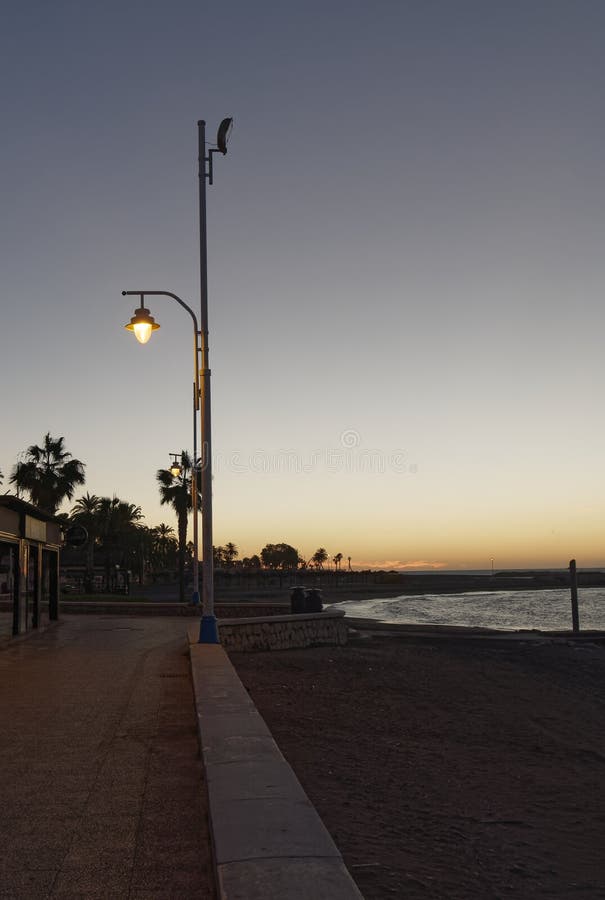 View of the Sea and Lamppost on the Pedregalejo Beach at Dusk Stock ...
