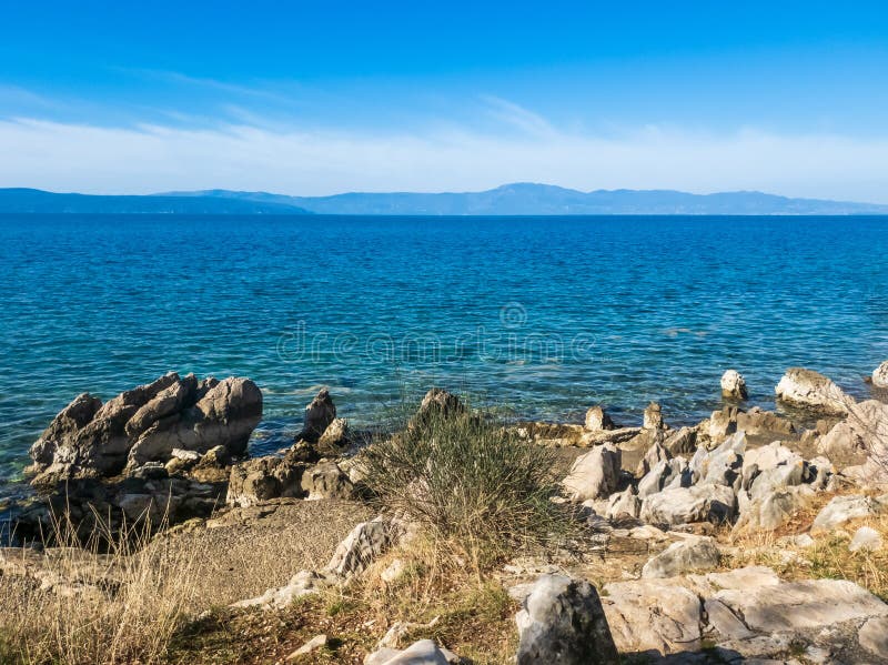 View of the Sea, Rocks and Mountains Stock Image - Image of blue ...