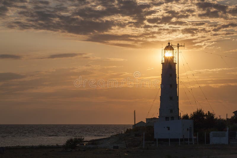 View at the Sea with Sun Lighting through Lamp of Lighthouse Stock ...
