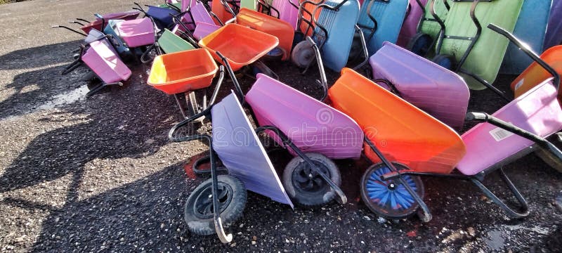 View of Up of Set of Colorful Wheelbarrows Stock Photo - Image of tire ...