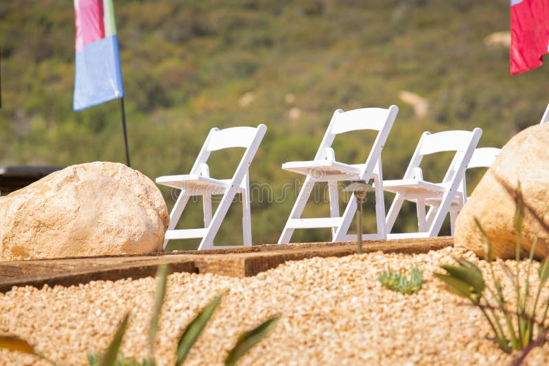 White event chairs stock image. Image of house, boulder - 240465997