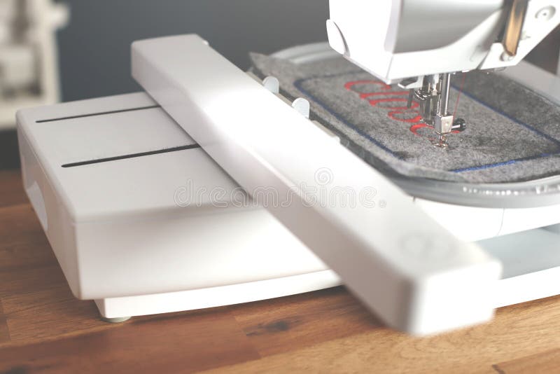 View on Sewing Machine and Embroidery Unit Stitching Red Lettering on ...