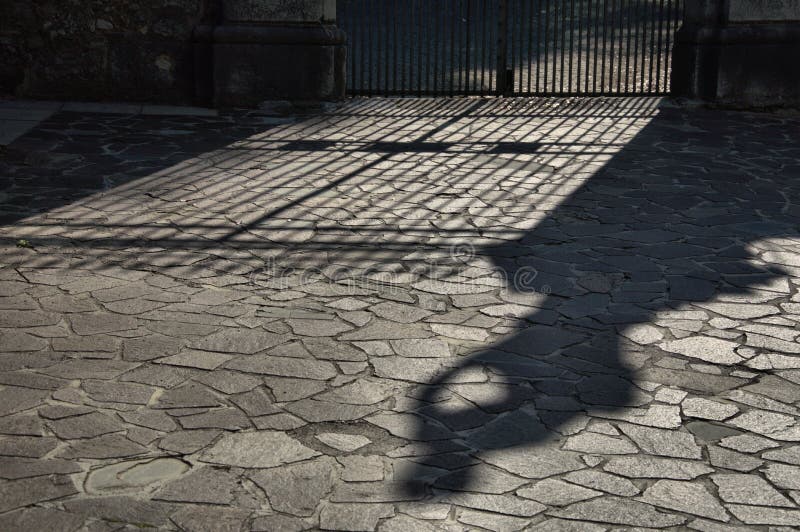 Shadows of statue and gate stock image. Image of sculpture - 139923487