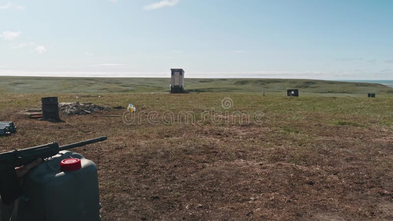 Side View of Unrecognizable Shooter Shooting into Target. Gun ...