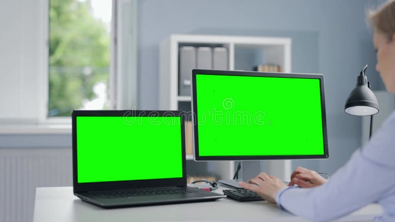 Woman Working on Two Computers Stock Video - Video of employee ...