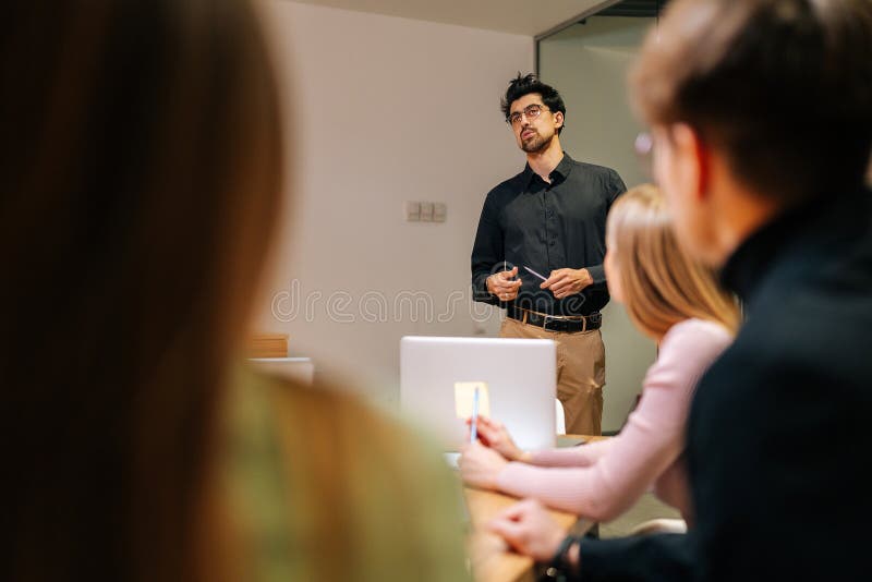 View from Shoulder To Male Business Team Leader Presenting Project Plan ...