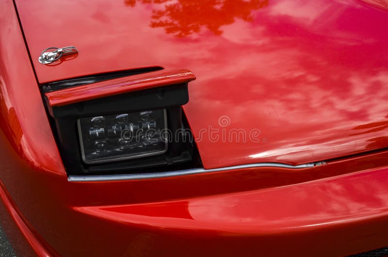 View Showcasing the Distinctive Pop-up Headlight of a Classic Red Car ...