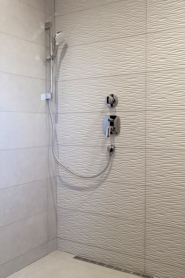 View of Shower Corner with Shower Head on One Wall and Hidden Mode ...