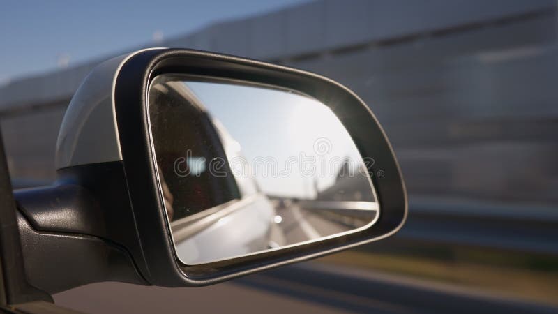 View from Side Mirror the Inside of a Driving Car Along Highway in a ...