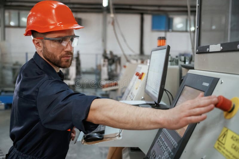 View from the Side, Working with Machine, Operator. Factory Worker is ...