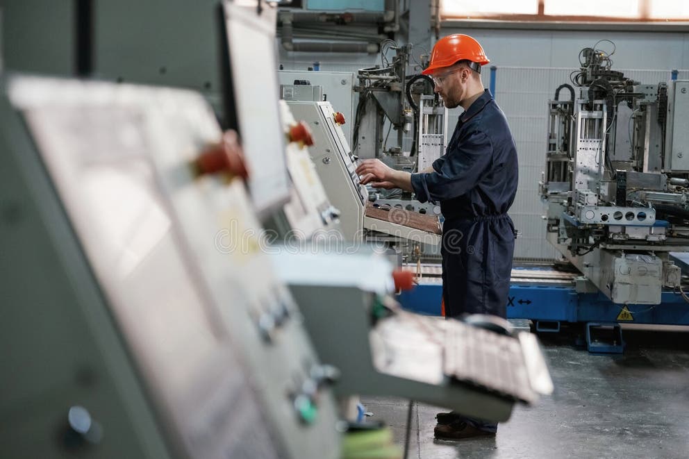 View from the Side, Working with Machine, Operator. Factory Worker is ...