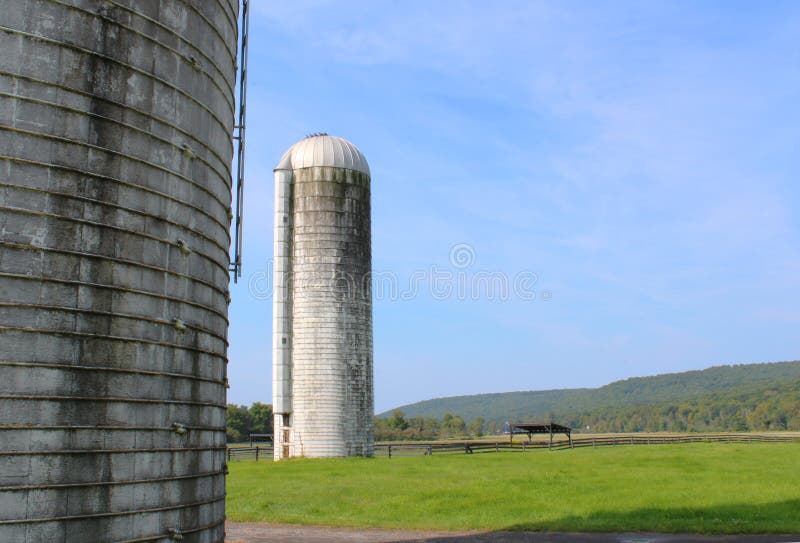 View of a Silo in the Distance with a Portion of a Silo To the Left ...