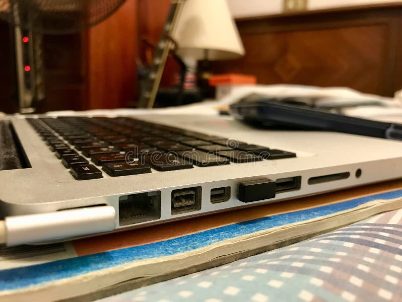 View of a Silver Metallic Laptop Computer Over a Drawing Notebook on ...
