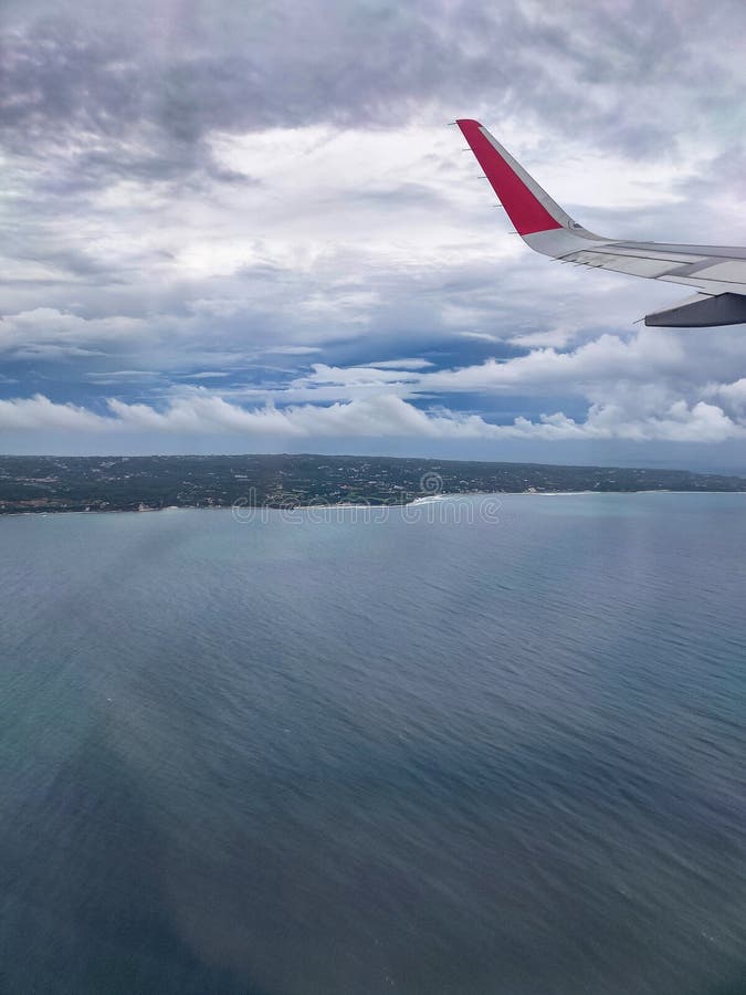 View of Singapore from a Landing Airplane Out the Window at Cloudy Day Stock Photo - Image of ...