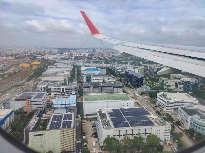 View of Singapore from a Landing Airplane Out the Window at Cloudy Day Stock Image - Image of ...