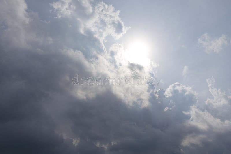 View of the Sky. Behind the Large Rain Clouds You Can See the Bright ...
