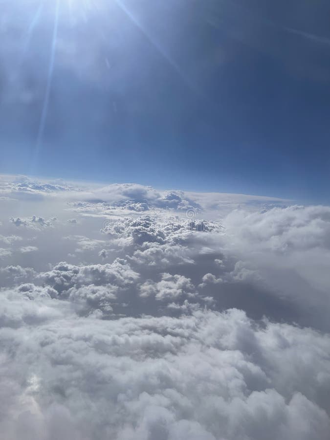 View of Sky and Sunshine Above the Clouds. Heaven Like View of Fluffy ...