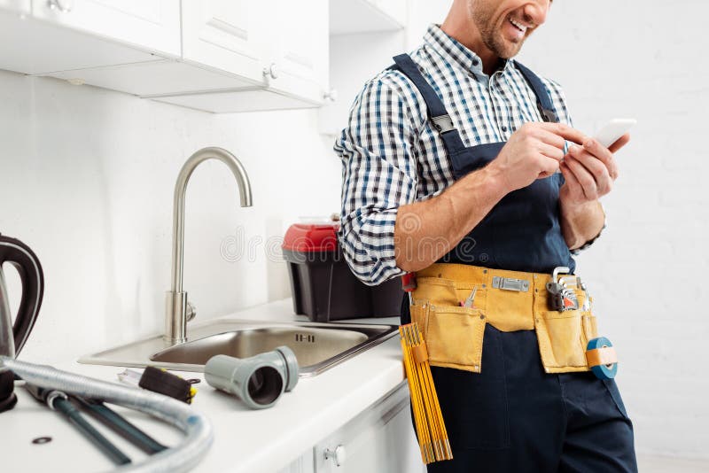 Smiling Plumber Holding Plunger Stock Photo - Image of studio, proud ...