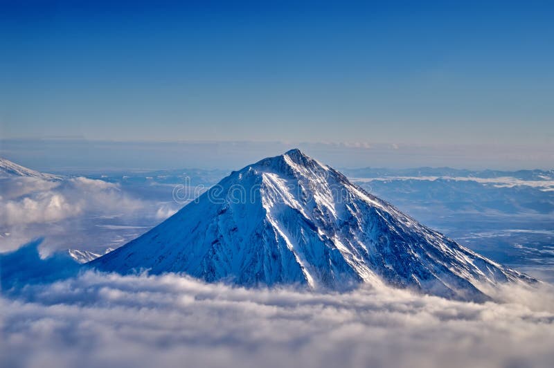 View of the Snow-capped Volcano from the Aircraft S Illuminator. Peak ...