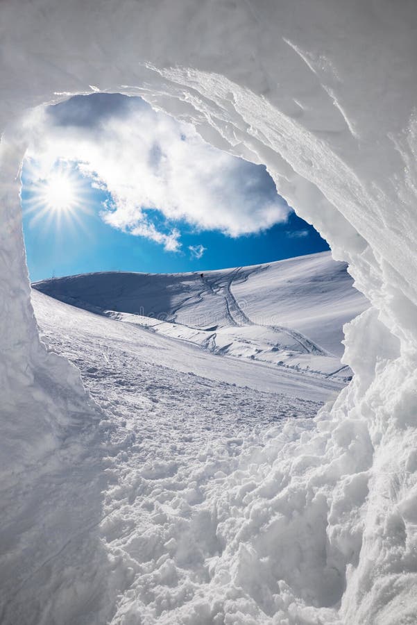 View through Snow Cave into Winter Landscape, Rofan Alps Stock Photo ...
