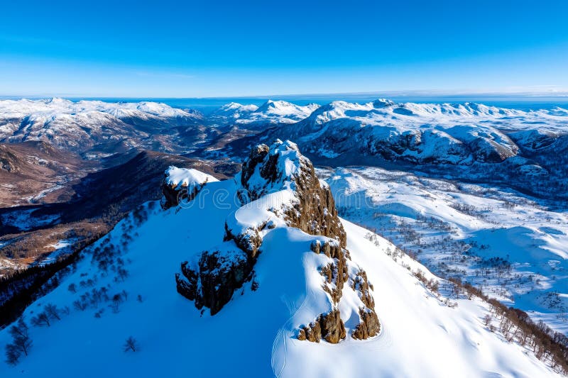 A View of a Snowy Mountain Range from the Top of a Mountain Stock Photo ...