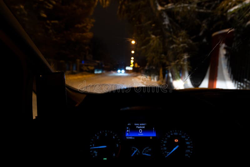 View of the Snowy Street through the Windshield of the Car. Stock Photo ...