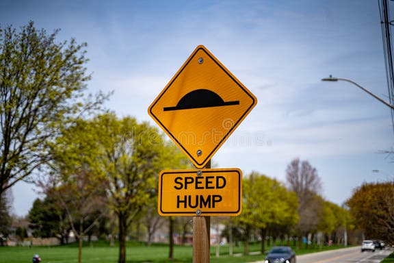 View of Speed Hump Sign on the Road Stock Photo - Image of ...