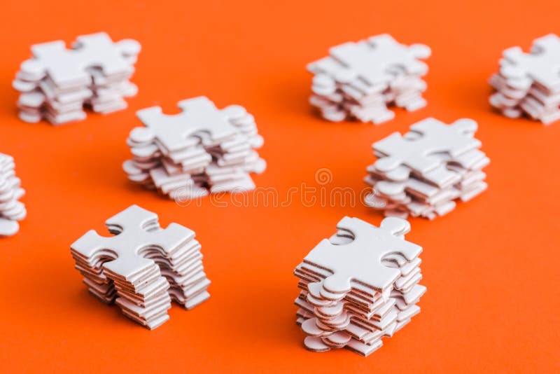 View of Stacked White Puzzle Pieces on Orange Stock Image - Image of ...