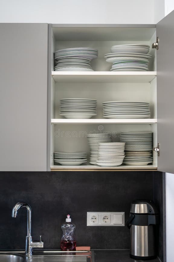 View of Stacks of Plates in a White Open Wall Cabinet in the Kitchen ...