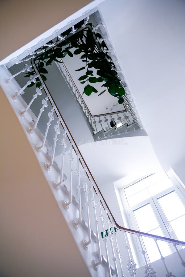 View of a Staircase and Its Railing from Below Stock Photo - Image of ...