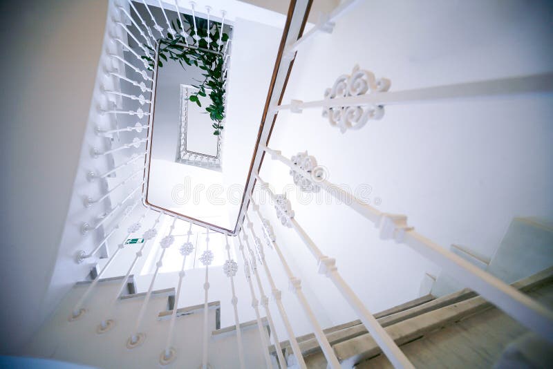 View of a Staircase and Its Railing from Below Stock Image - Image of ...