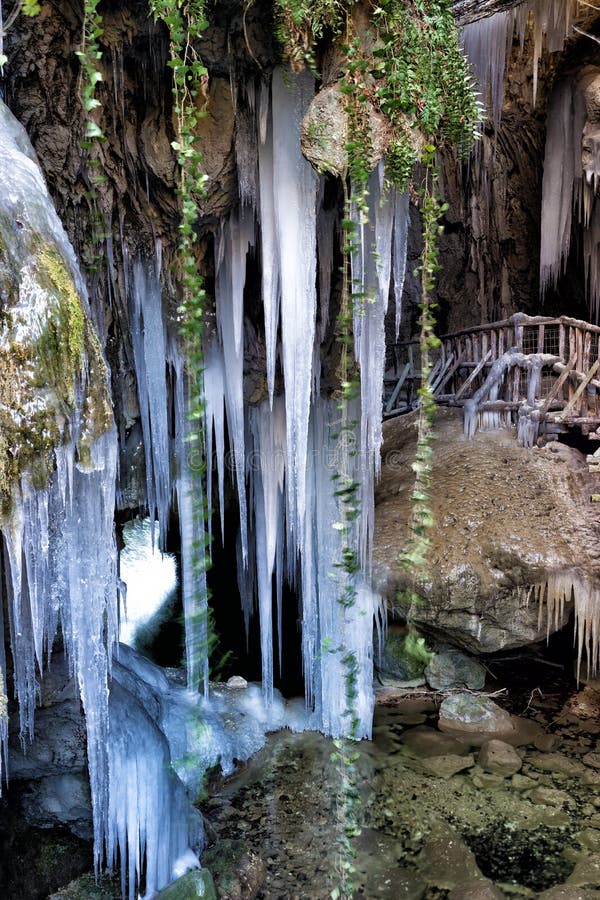 View of Stalactites and Stalagmites of Ice at the Entrance of a Cave ...