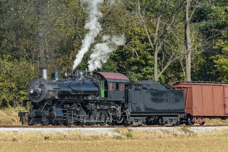 View of a Steam Freight Train on a Single Track Going Thru Rural ...