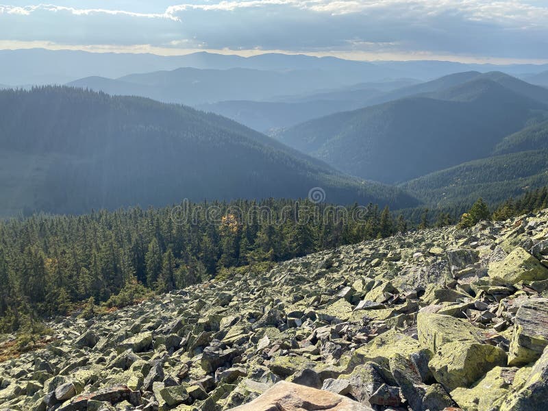 View from a Stone Peak Overlooking Distant Mountains Stock Image ...